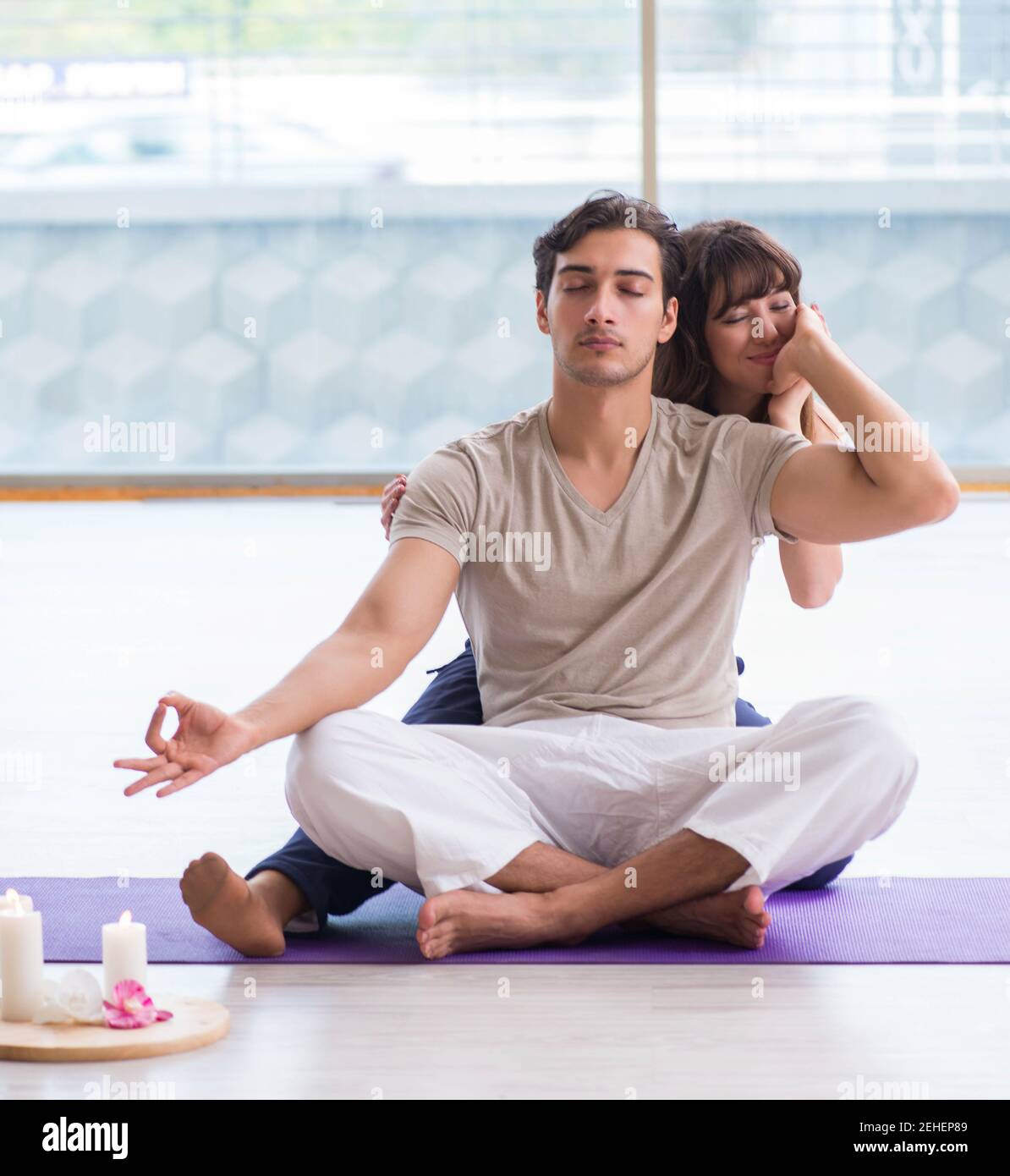 The personal coach helping during yoga session Stock Photo - Alamy