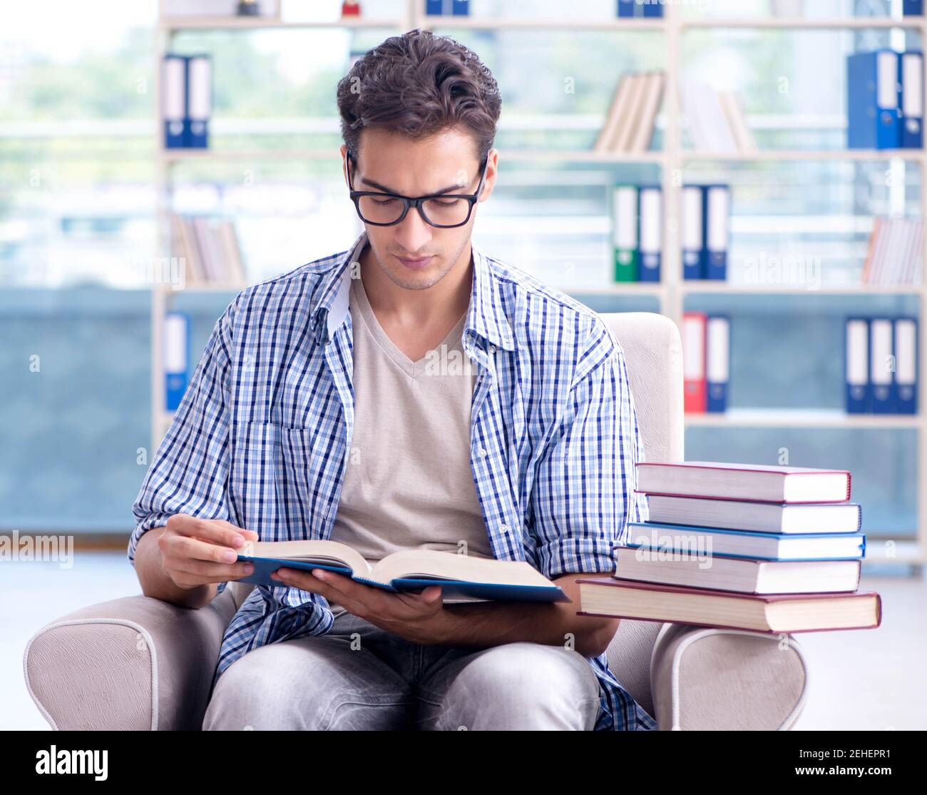The student reading books and preparing for exams in library Stock ...