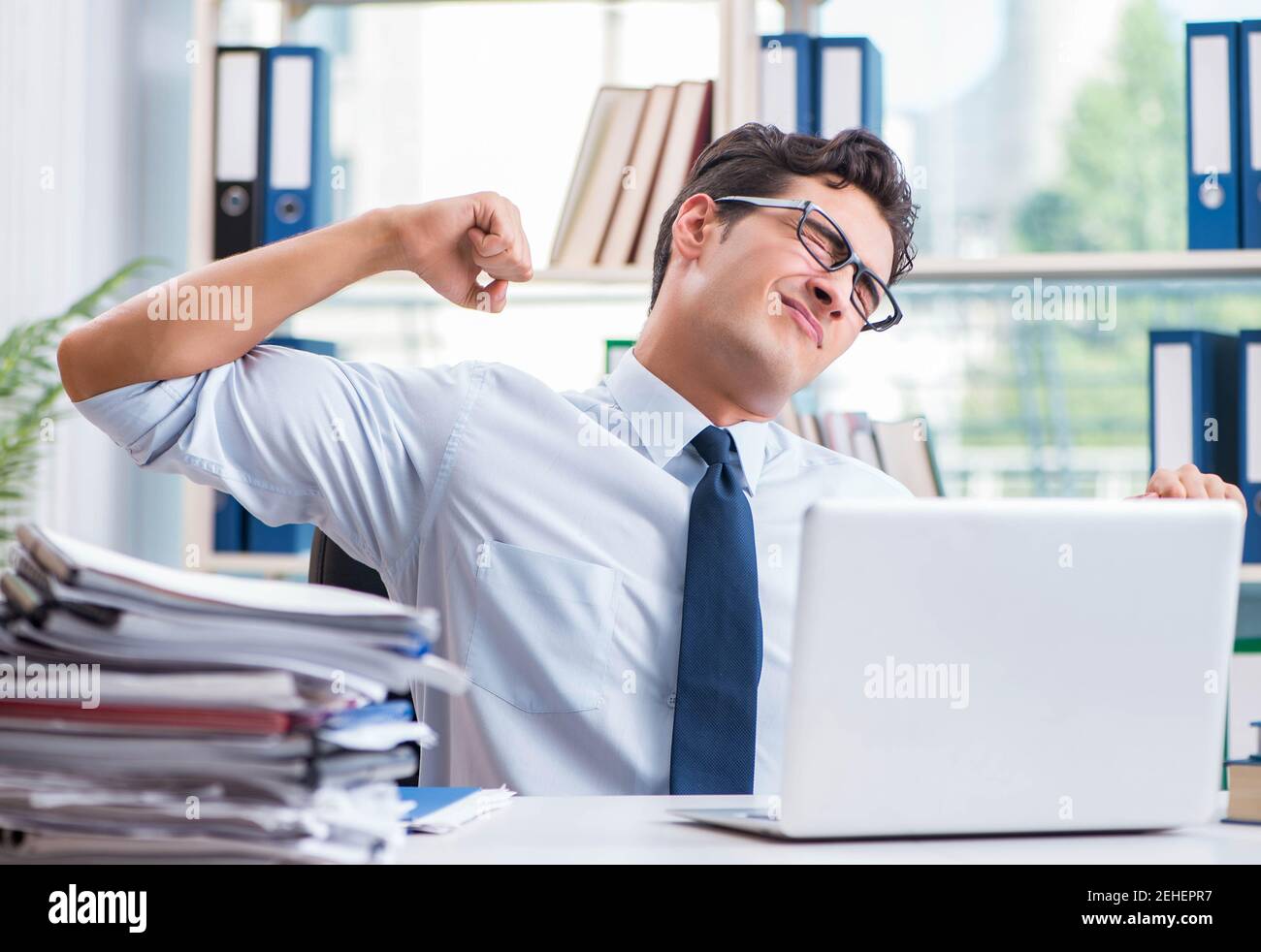 The tired exhausted businessman sitting in the office Stock Photo - Alamy