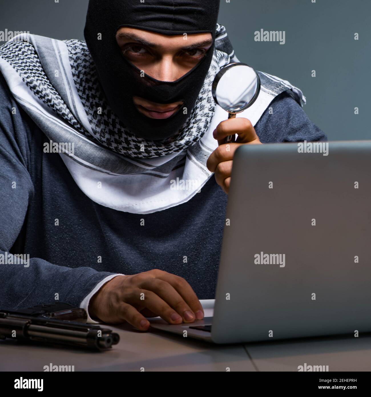 The hacker wearing balaclava mask hacking computer Stock Photo - Alamy