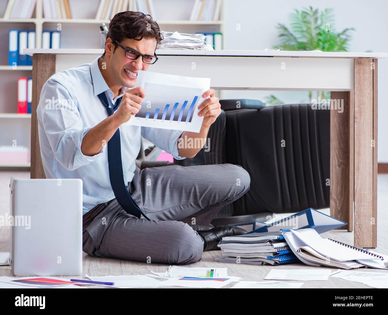 The bankrupt businessman angry in the office floor Stock Photo - Alamy