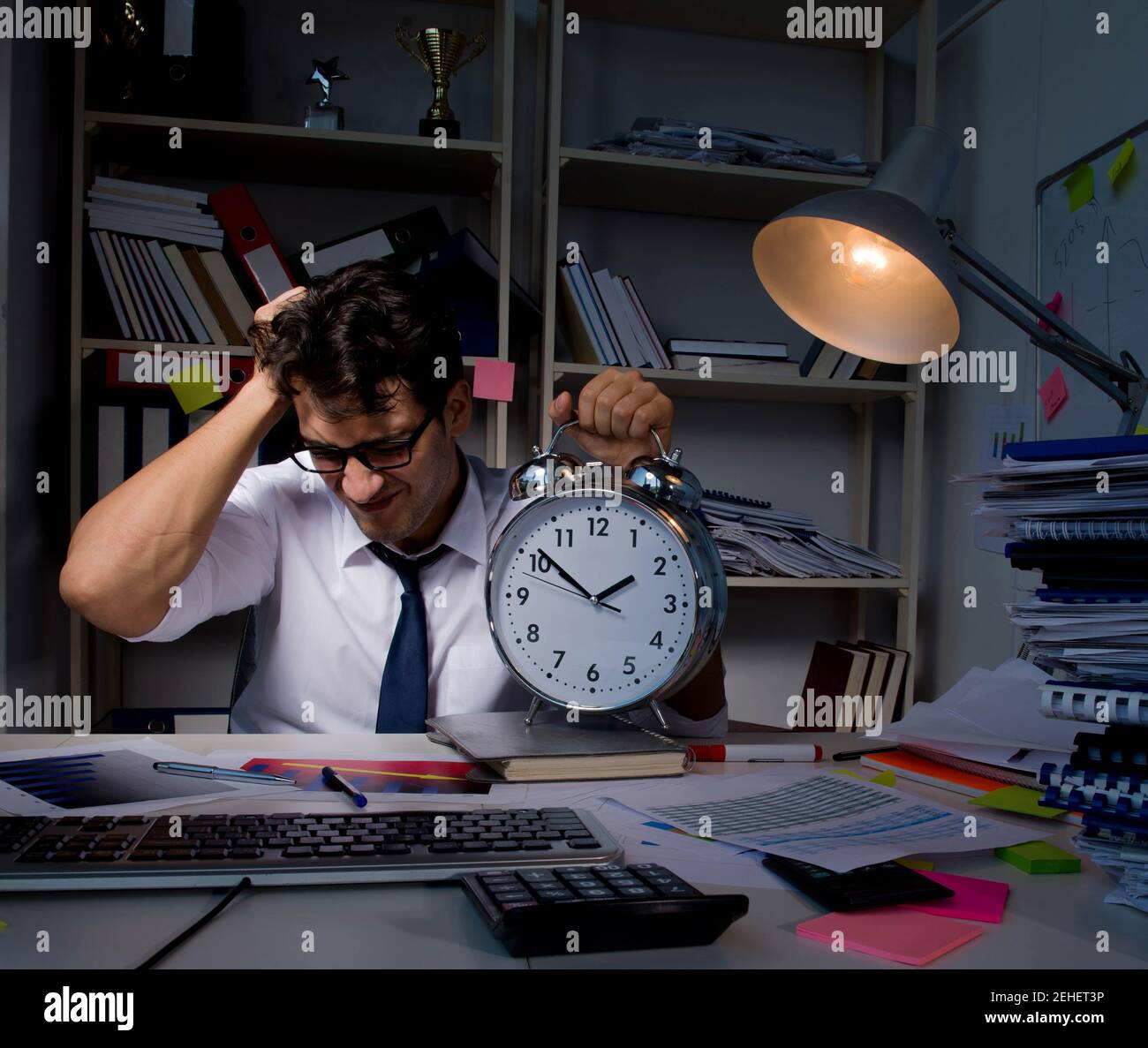 The man businessman working late hours in the office Stock Photo - Alamy