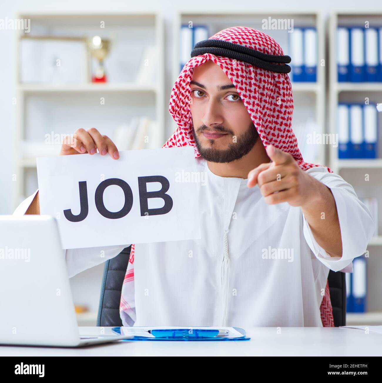 Arabian man pointing laptop hi-res stock photography and images - Alamy