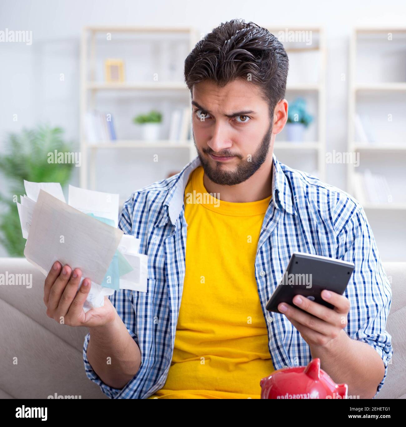 The man angry at bills he needs to pay Stock Photo - Alamy