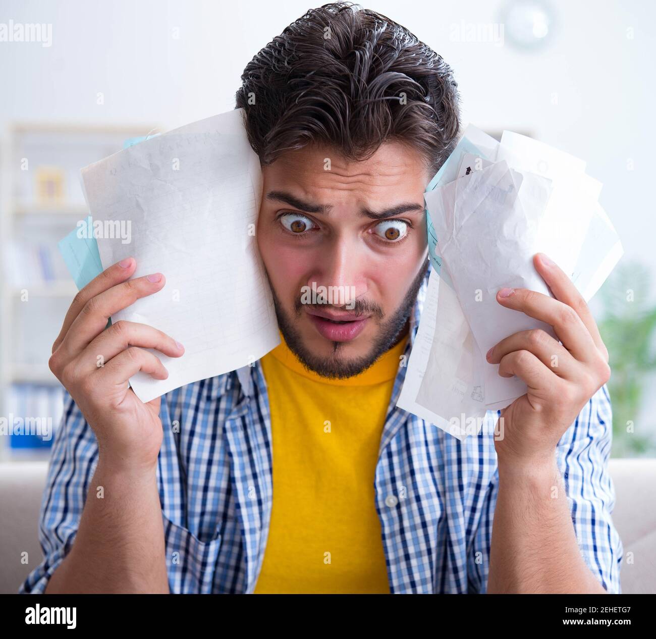 The man angry at bills he needs to pay Stock Photo - Alamy