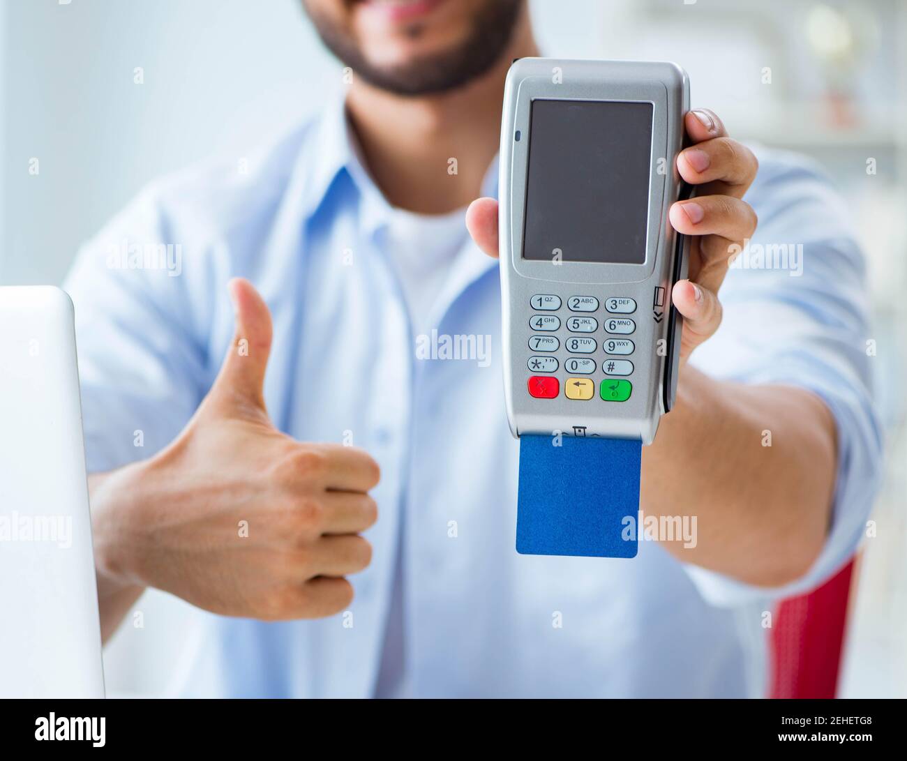 The man processing credit card transaction with pos terminal Stock ...