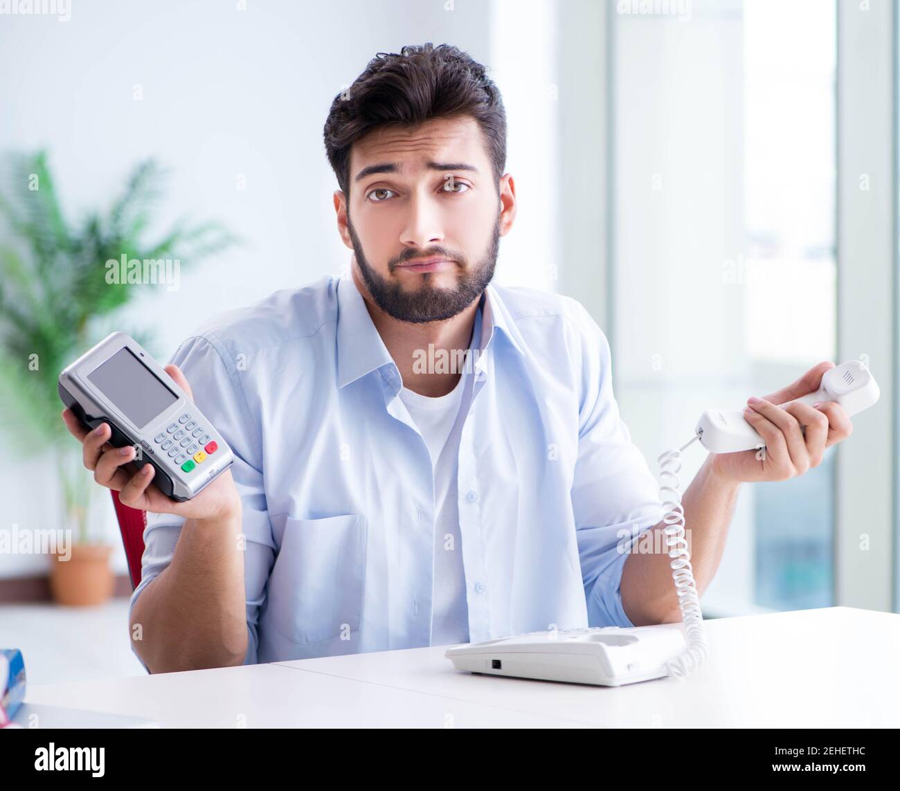 The man processing credit card transaction with pos terminal Stock ...