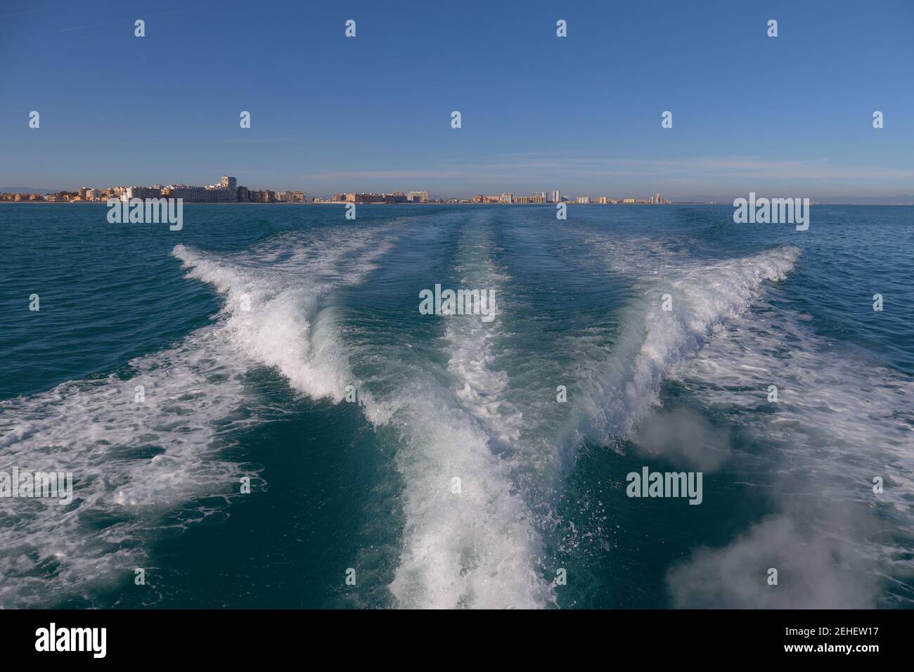 waves produced by a ship sailing through the ocean at high speed. Water ...