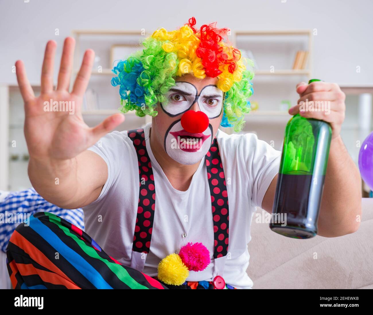 The drunk clown celebrating having a party at home Stock Photo - Alamy