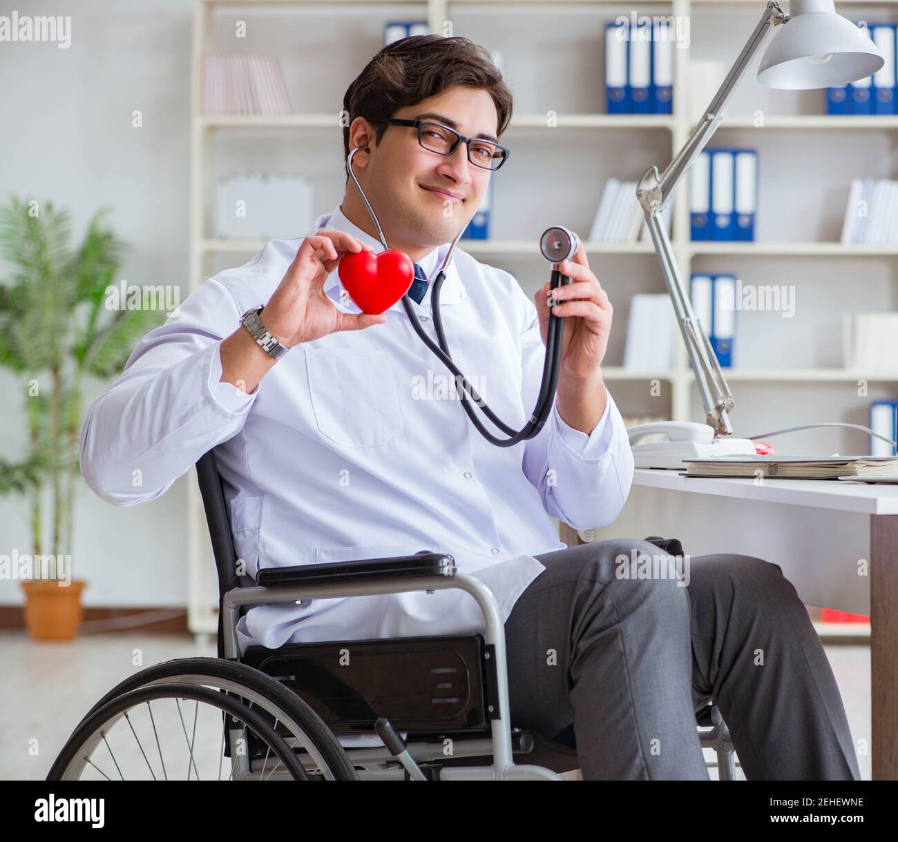 The disabled doctor on wheelchair working in hospital Stock Photo - Alamy