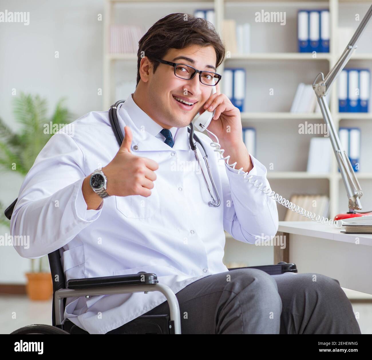 The disabled doctor on wheelchair working in hospital Stock Photo - Alamy