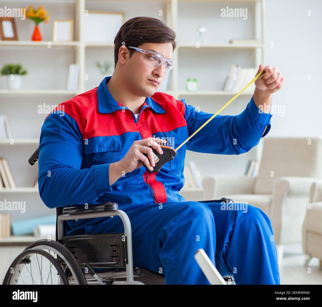 The disabled man measuring with meter Stock Photo - Alamy