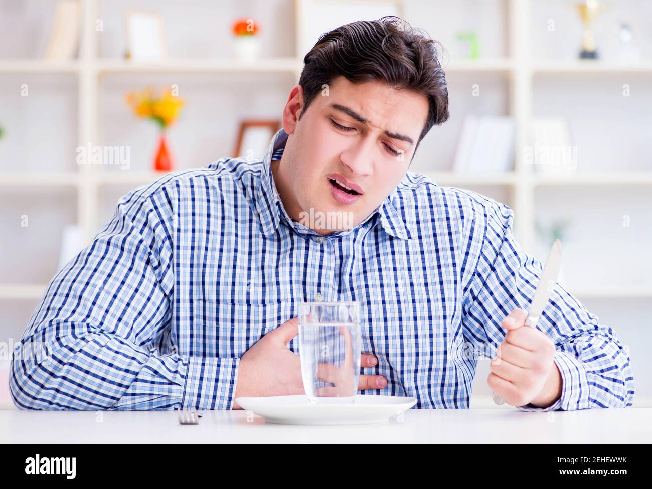 The man on diet waiting for food in restaurant Stock Photo - Alamy
