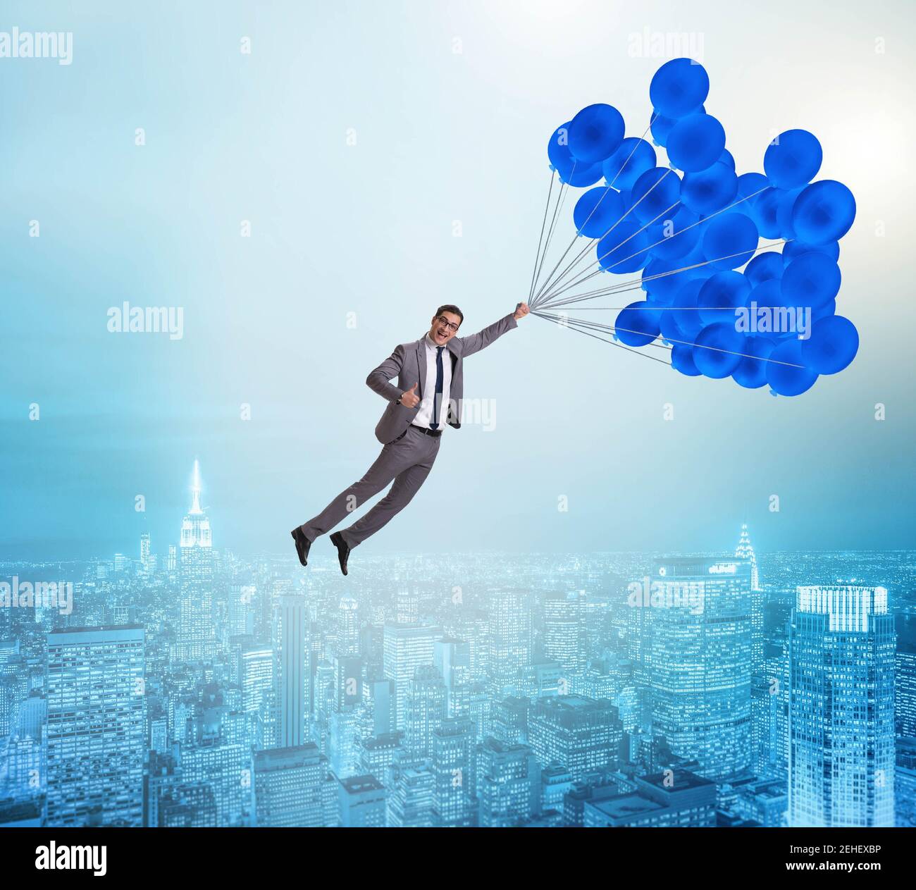 The businessman flying on balloon in challenge concept Stock Photo - Alamy