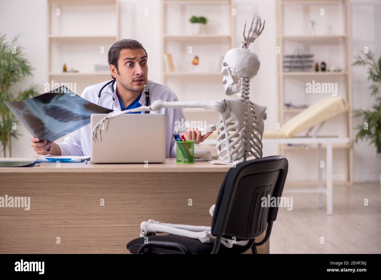 Young doctor radiologist and skeleton patient in the clinic Stock Photo ...