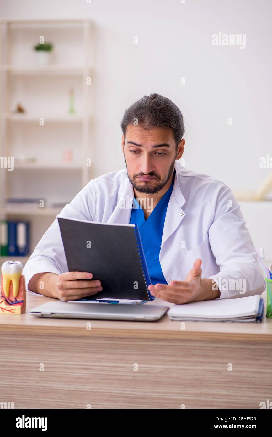 Young odontologist working in the clinic Stock Photo - Alamy