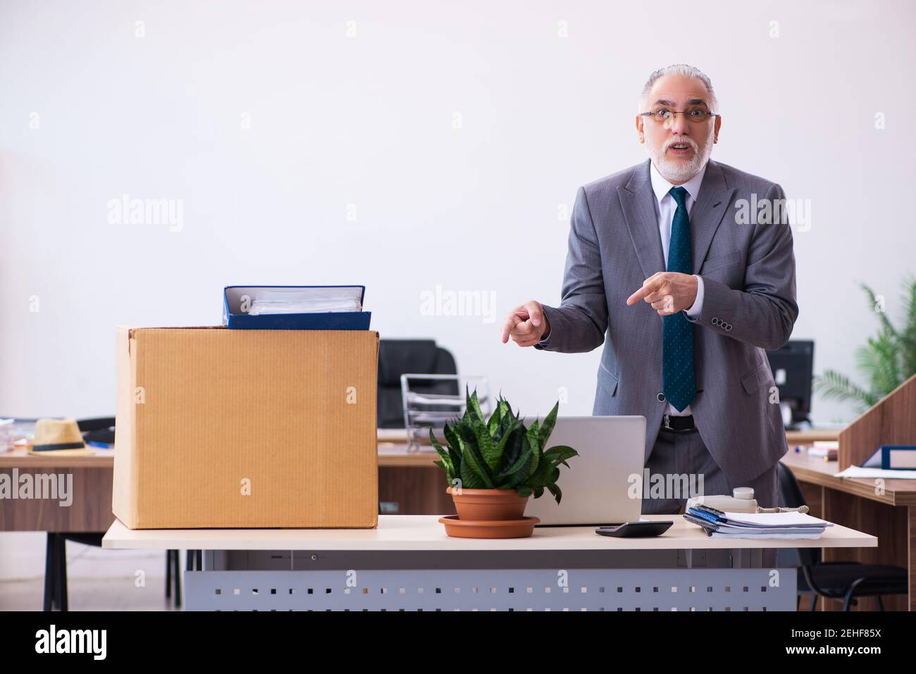 Old employee being fired from his work Stock Photo - Alamy