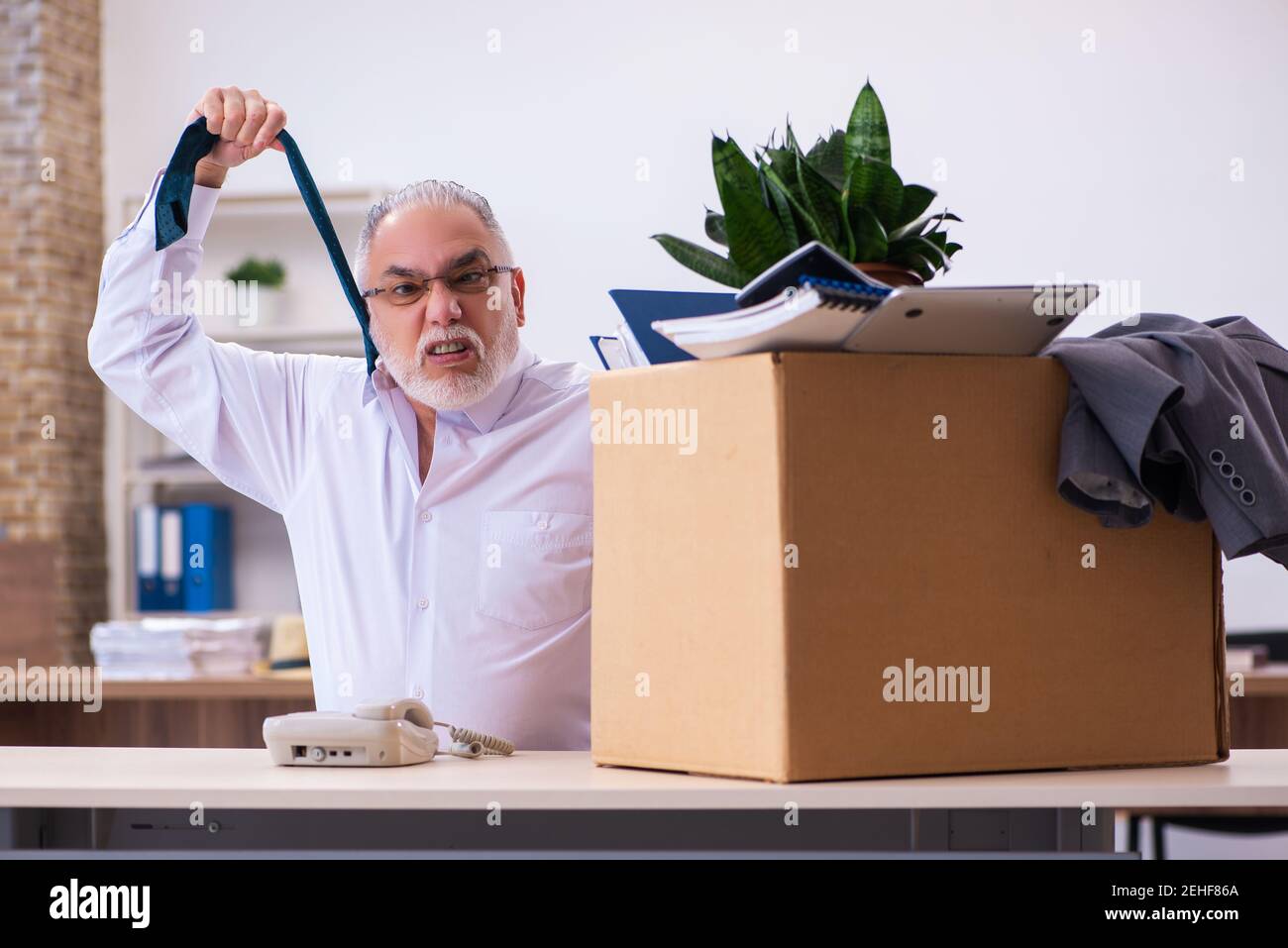 Old employee being fired from his work Stock Photo - Alamy