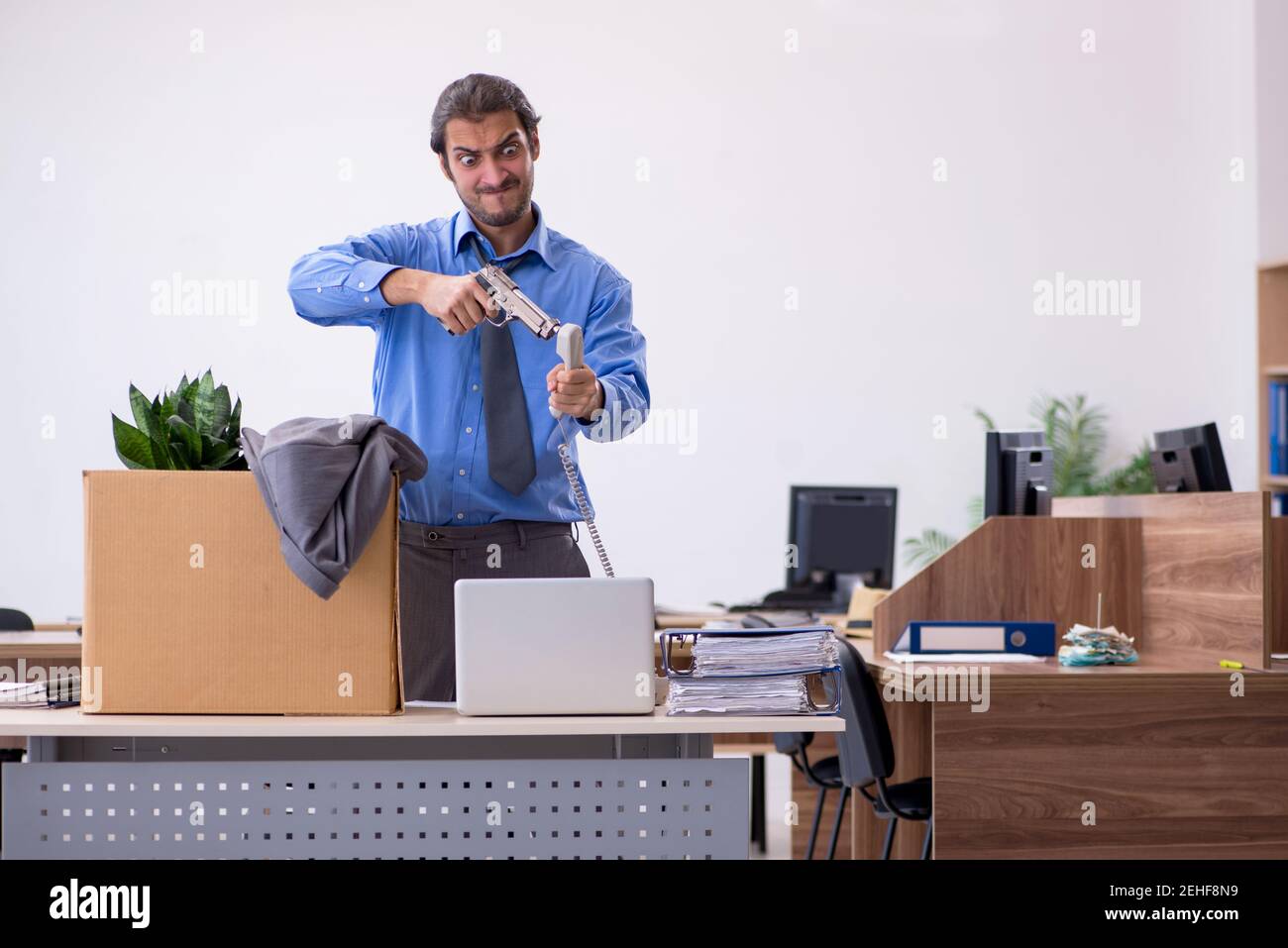 Young employee being fired from his work Stock Photo - Alamy