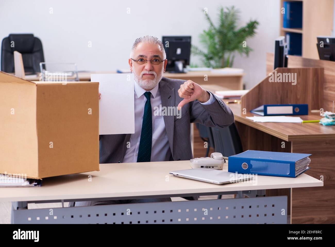 Old employee being fired from his work Stock Photo - Alamy