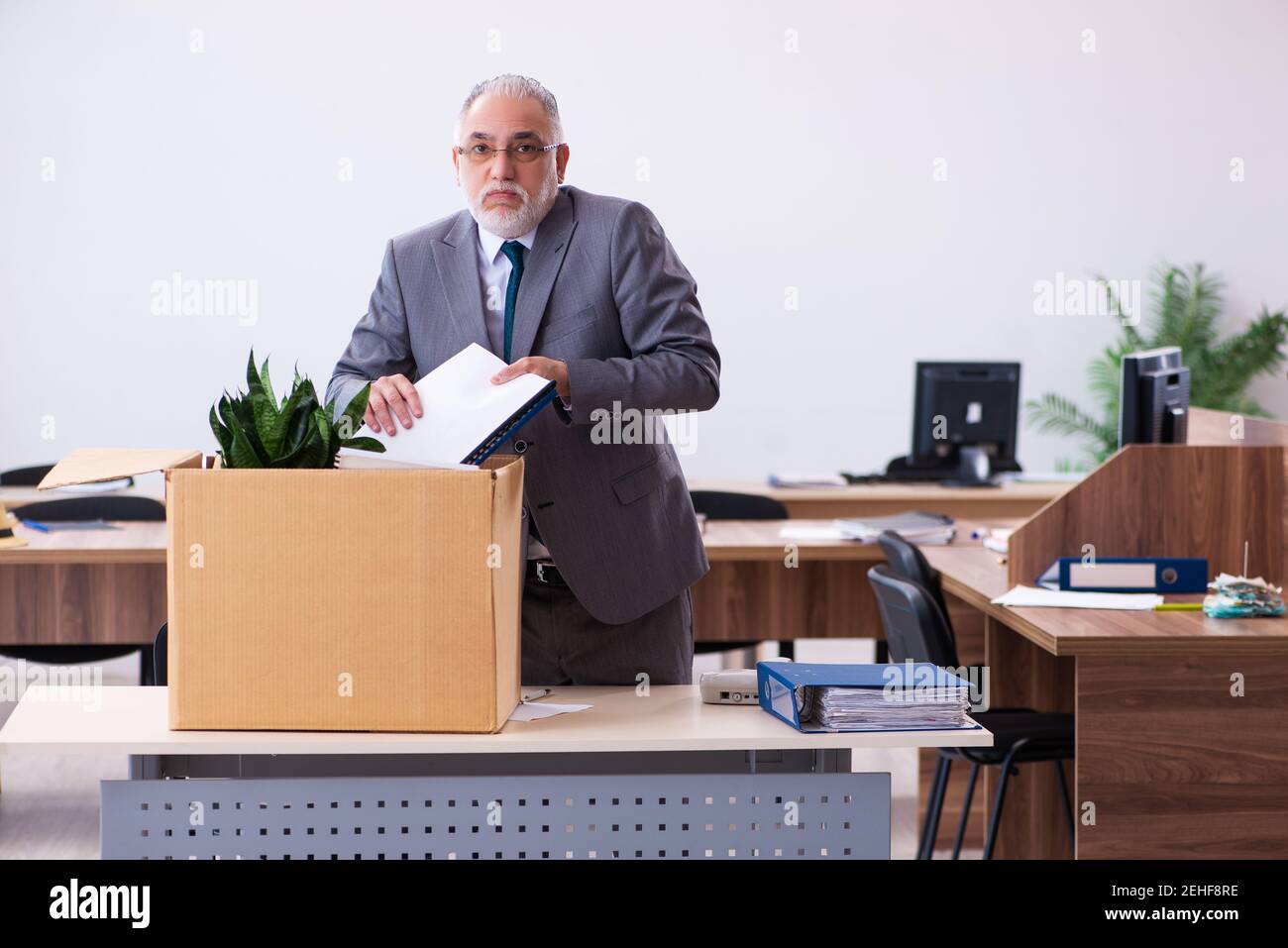 Old employee being fired from his work Stock Photo - Alamy