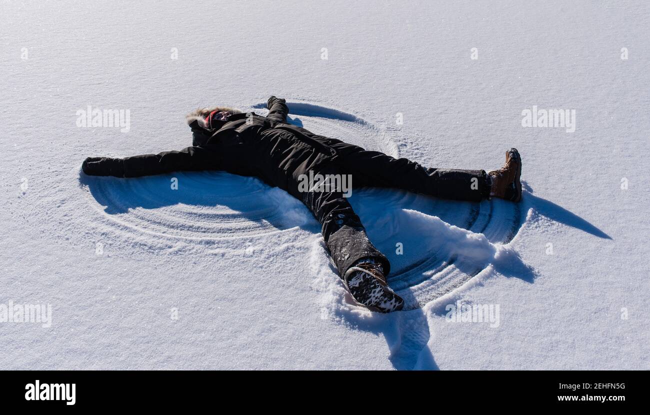 Snow angel adult hi-res stock photography and images - Alamy