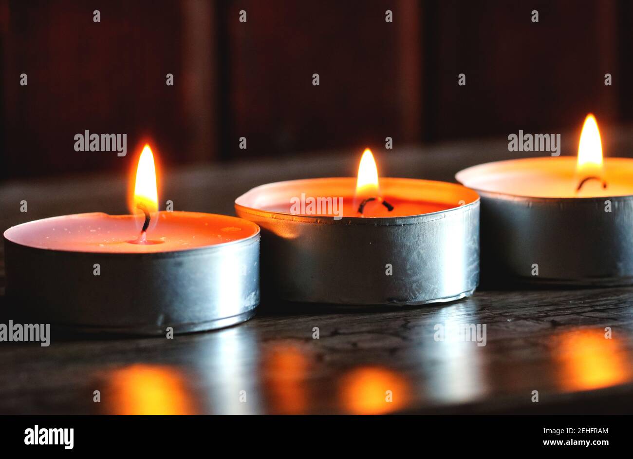 Three candle lights at home Stock Photo - Alamy