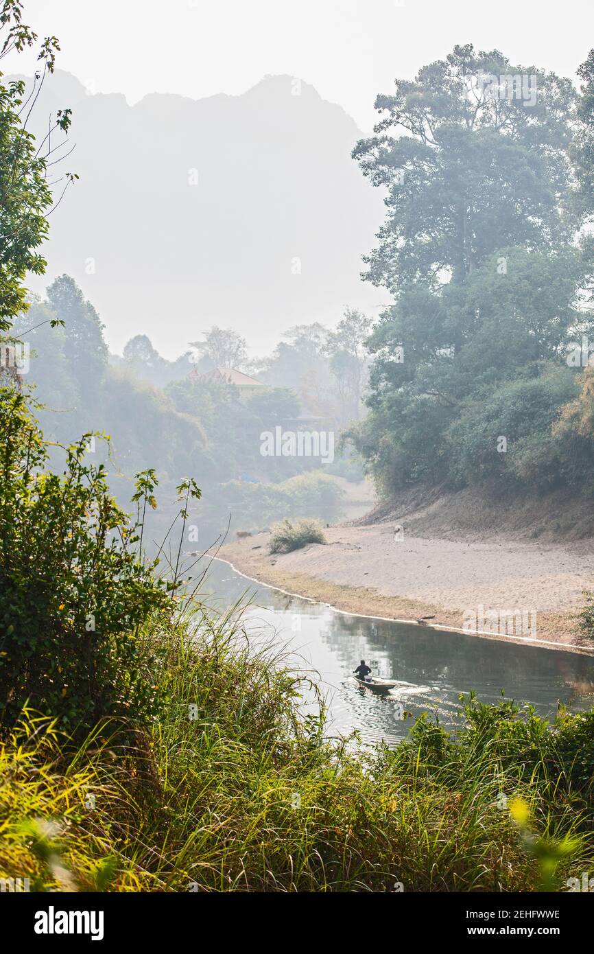 Man rowing boat on still river hi-res stock photography and images - Alamy