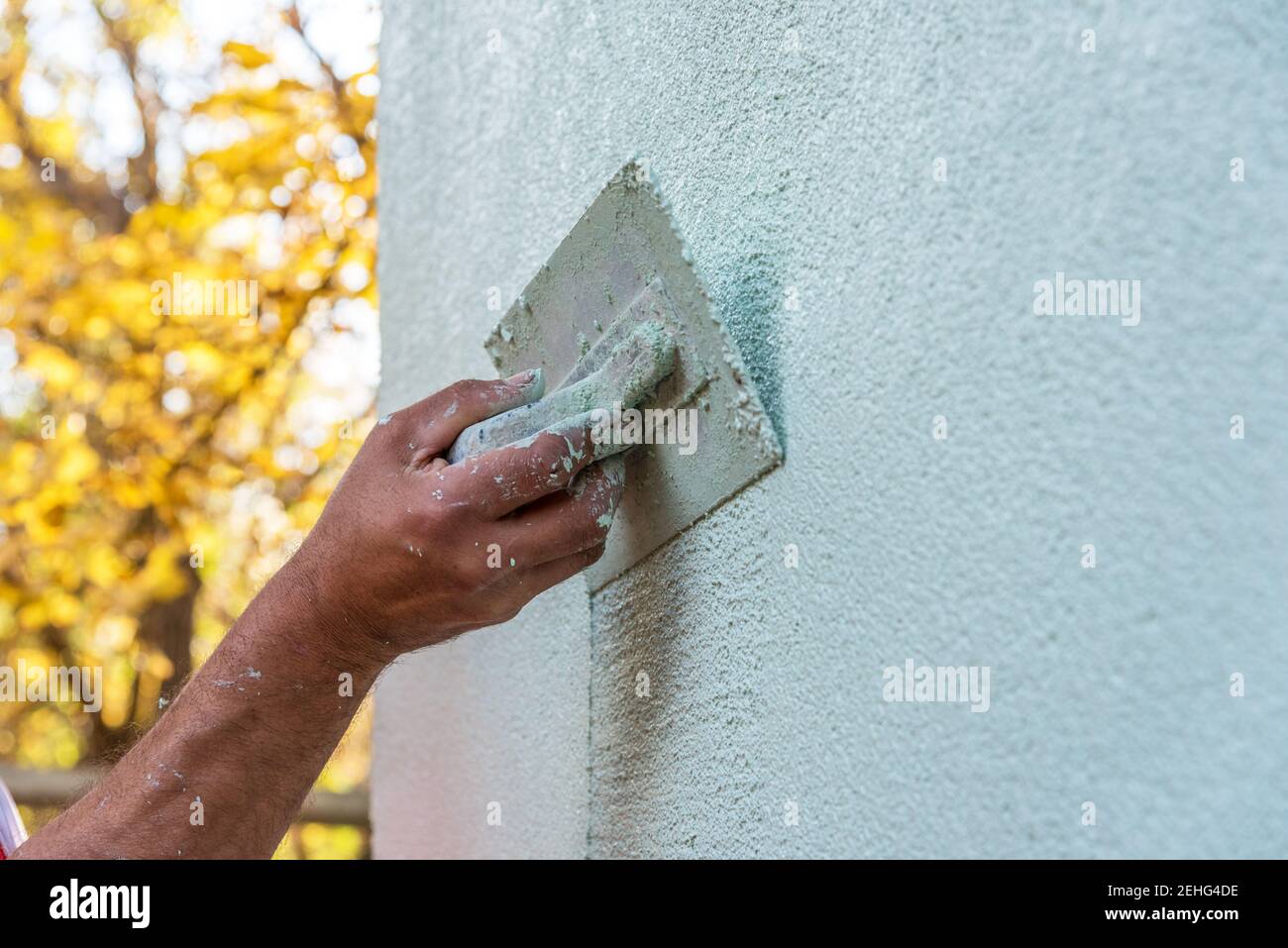 Application Of Facade Plaster,worker Plastering The Facade Of The ...