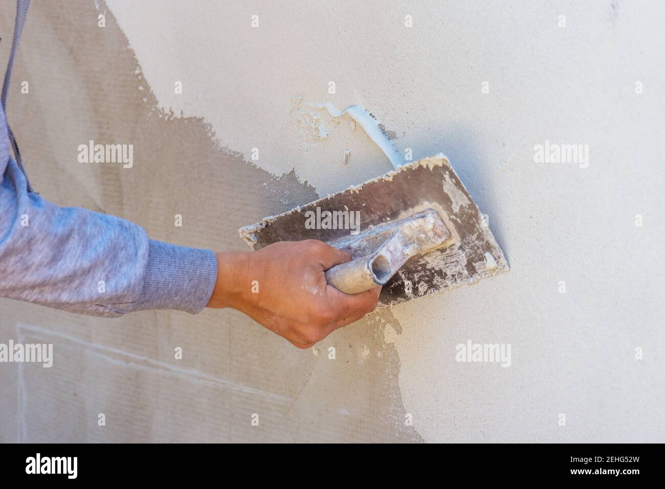 Person applying paint wall using hi-res stock photography and images ...