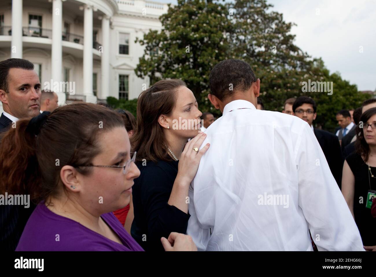 President Barack Obama talks with his personal secretary Katie Johnson ...