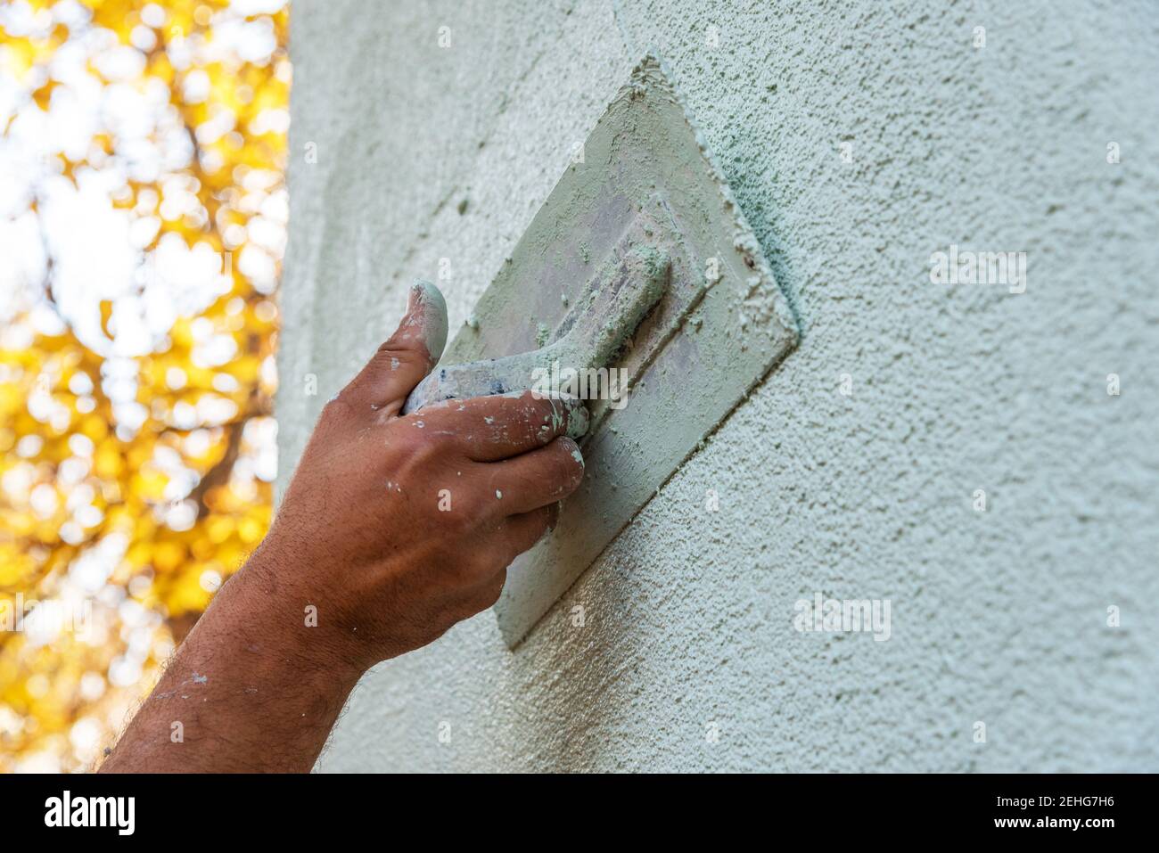 Application Of Facade Plaster,worker Plastering The Facade Of The ...