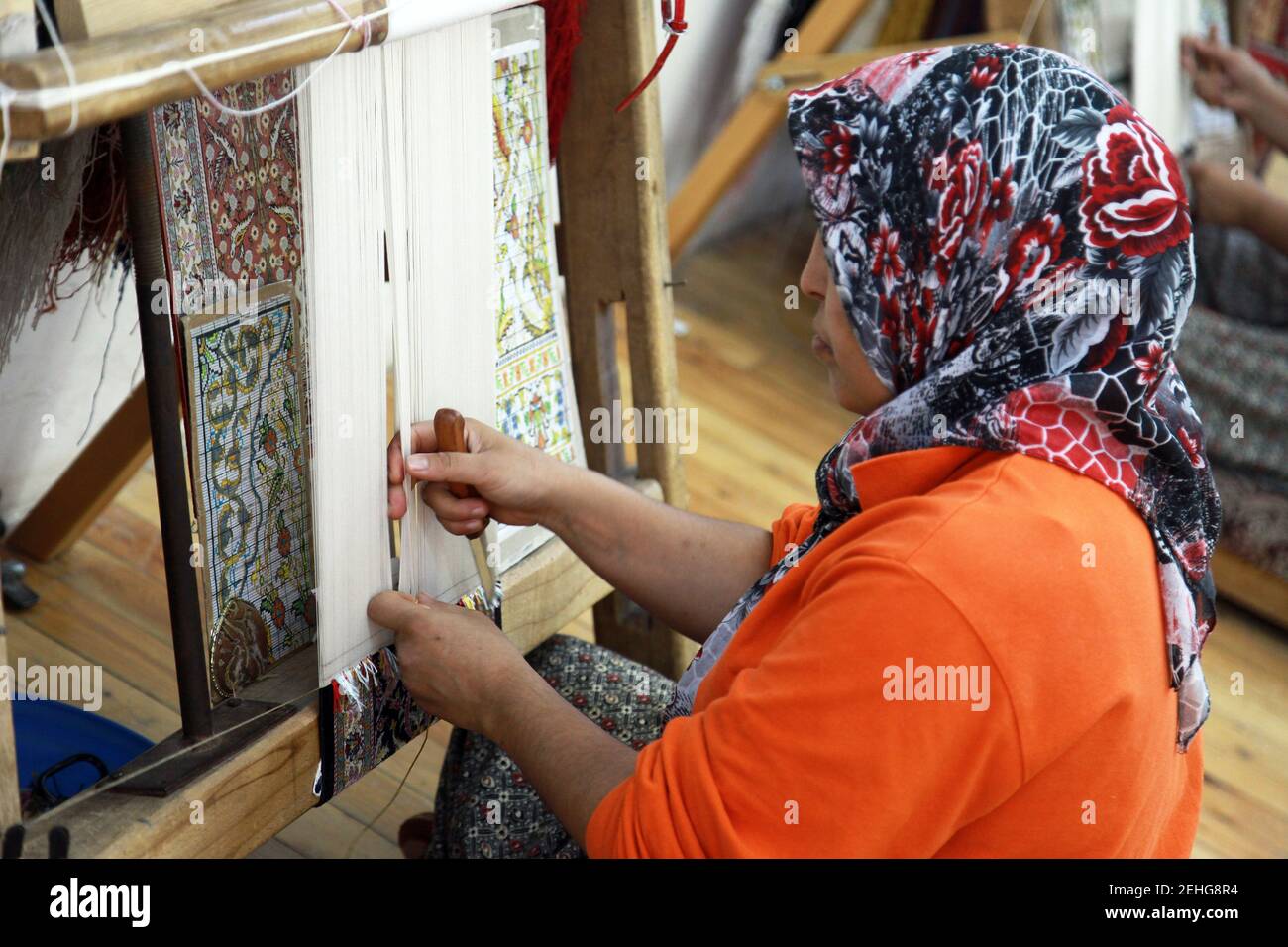 A woman making Traditional Turkish Carpet at Cappadocia in Nevsehir ...
