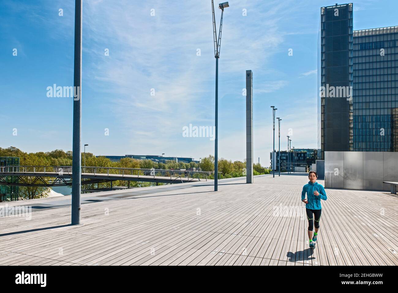 Woman running in Paris Stock Photo - Alamy