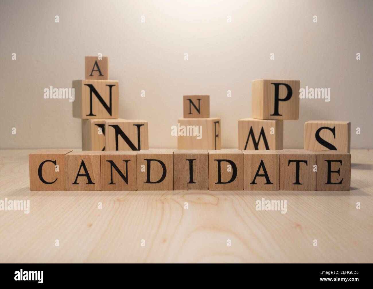 The word candidate is from wooden cubes. Background from wooden letters ...
