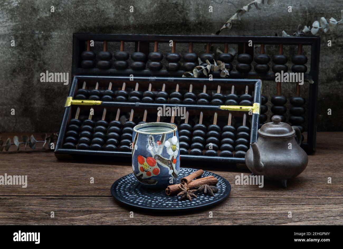 Chinese herbal tea and Vintage wooden hand abacus over Old wood table ...
