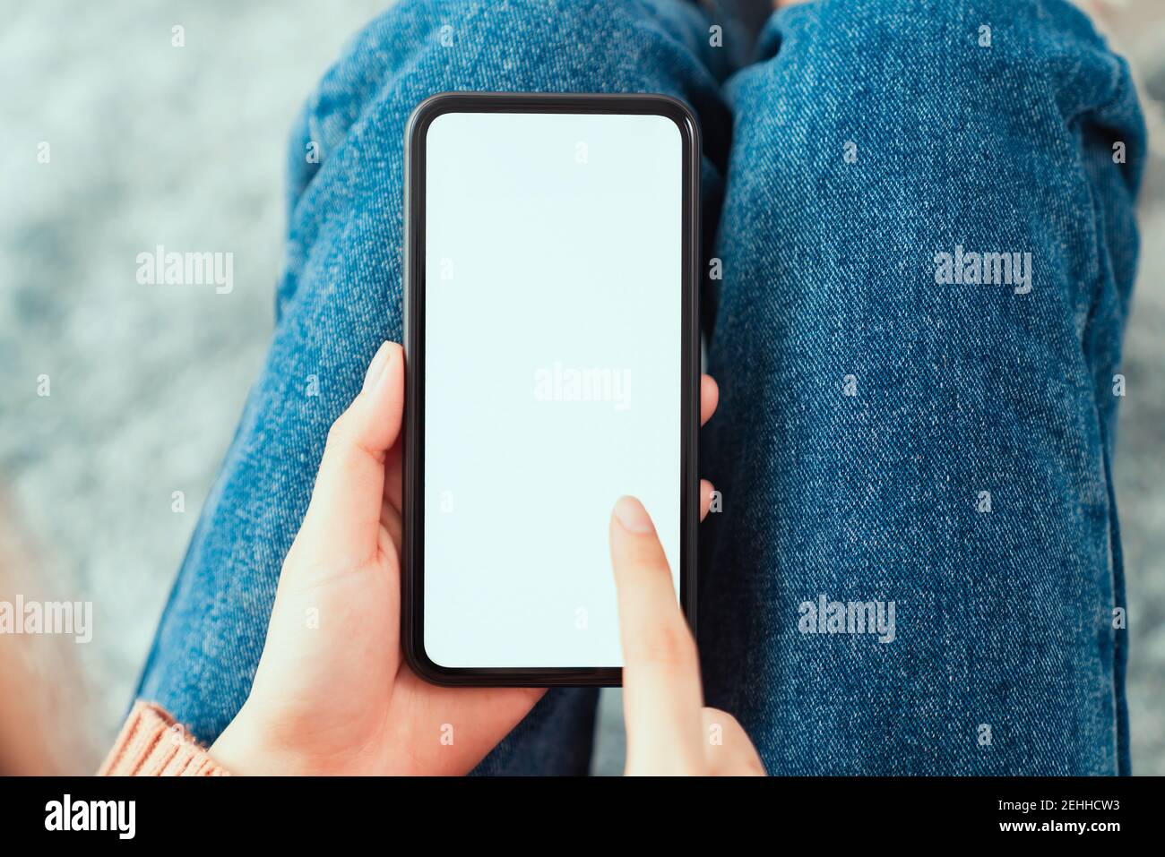 Hand holding smartphone mockup of blank screen. Take your screen to put ...