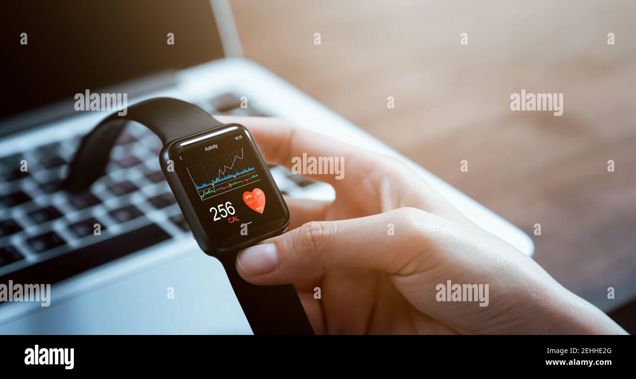 Close up of hand touching smartwatch with health app on the screen ...