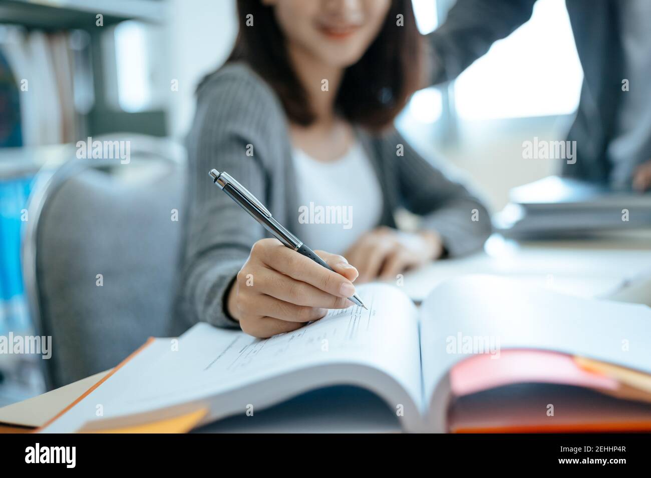 Hand high school or college students hold pen and learning tutoring on ...