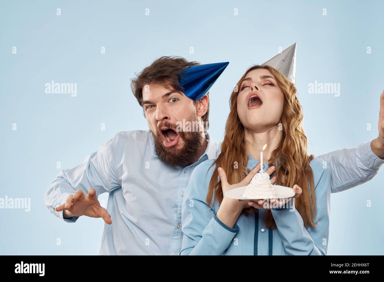 Party man and woman birthday cake corporate fun blue background Stock ...
