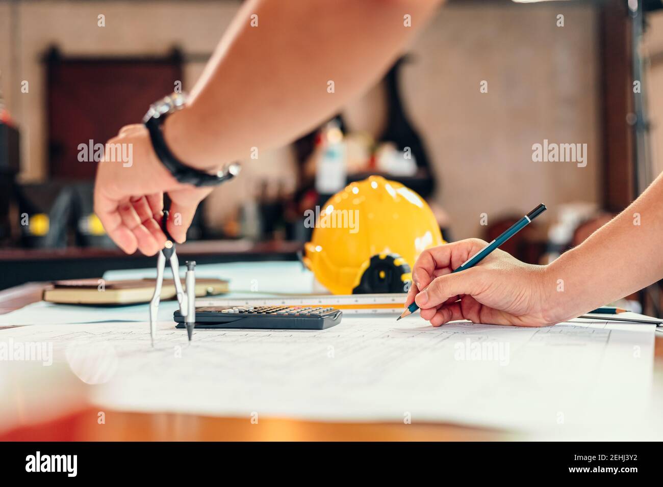 Architect using divider compass working on blueprint. blueprints, ruler ...