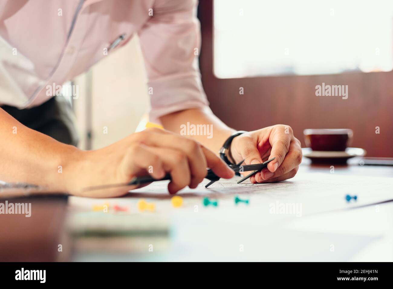 Engineering hands hold vernier caliper working and checking drawing ...