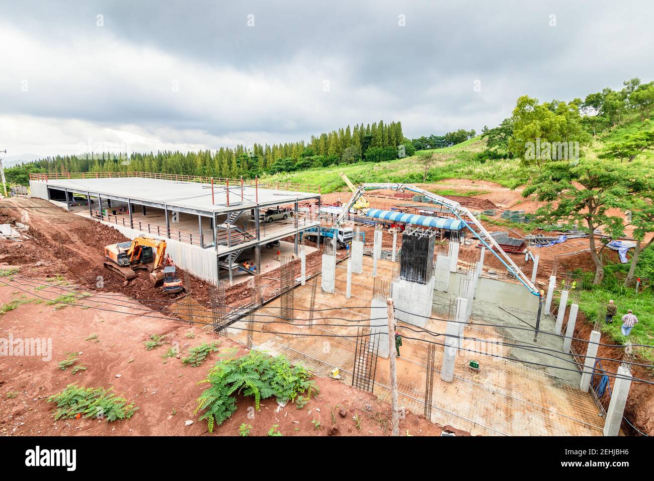 people working at site construction under rain cloud Stock Photo - Alamy