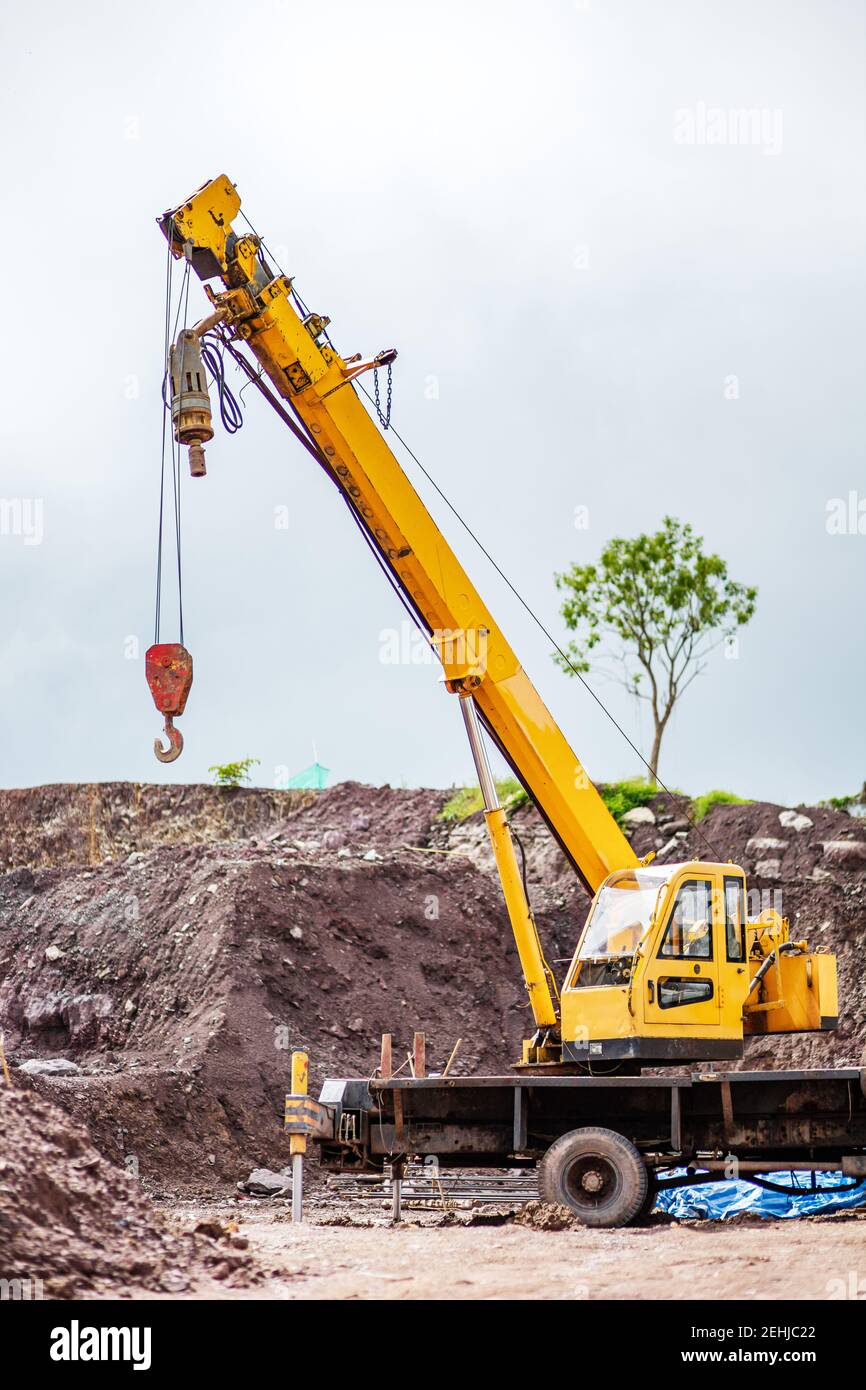 Truck crane standing on a construction site Stock Photo - Alamy