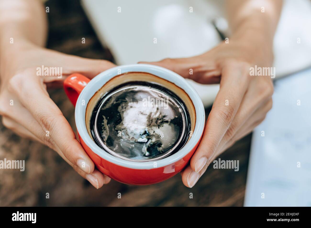 Hand hold cup of coffee between working. Drink of coffee Stock Photo ...