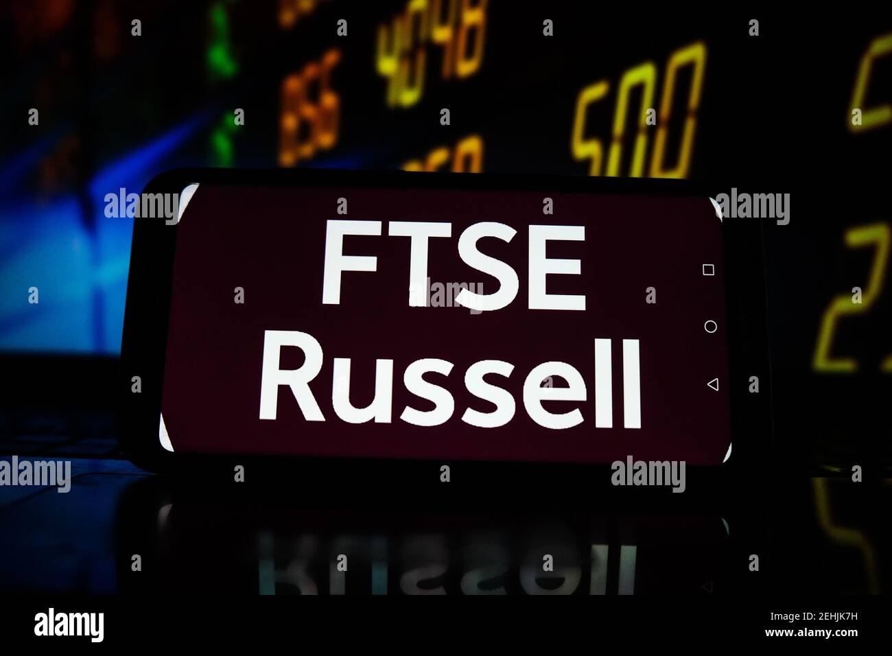 In this photo illustration an FTSE Russell logo seen displayed on a ...