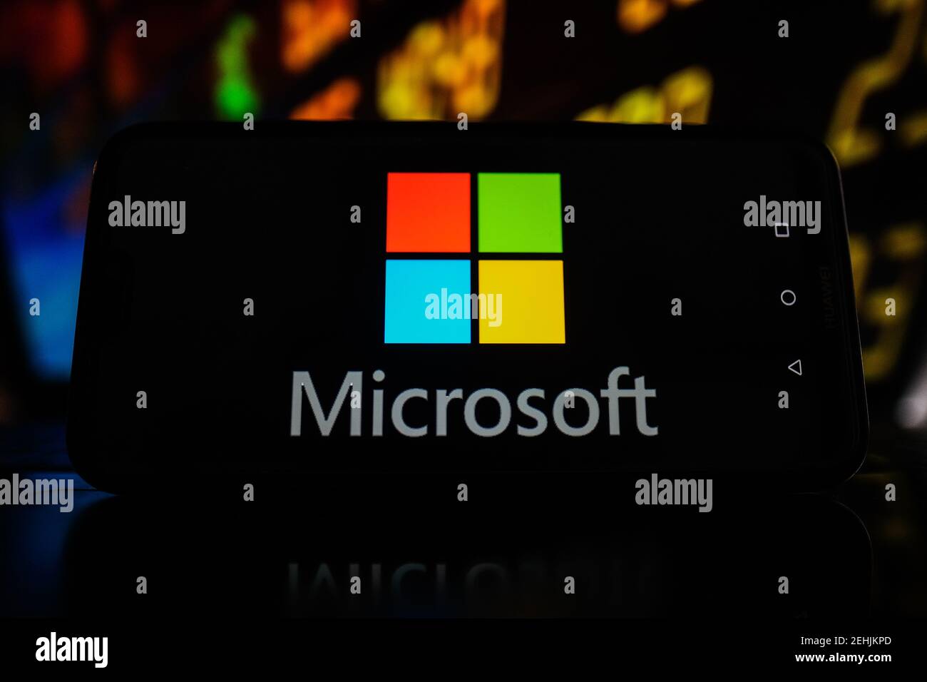 In this photo illustration a Microsoft logo seen displayed on a ...