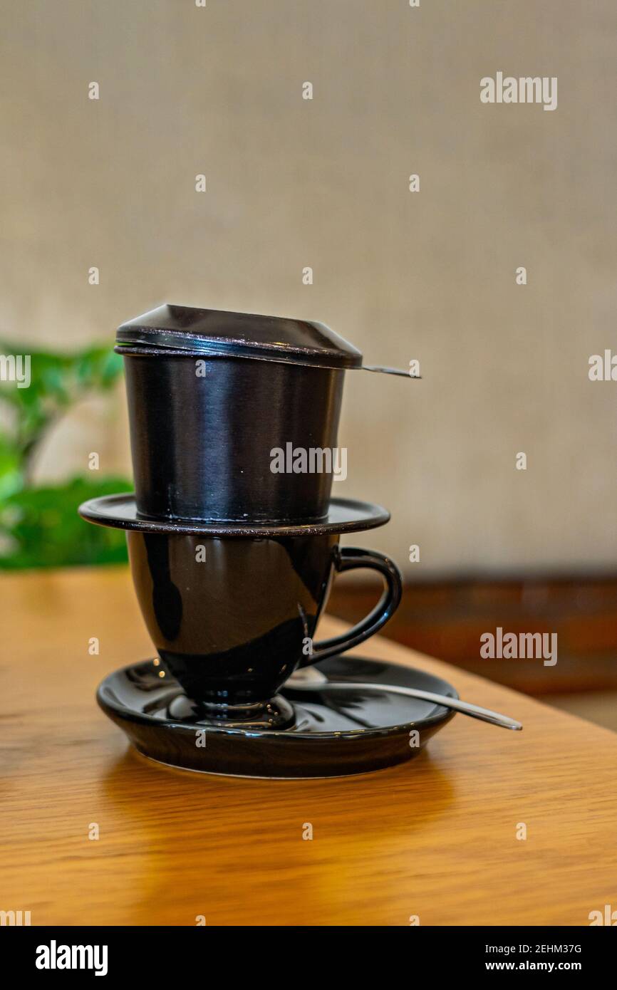 Close up photo of Vietnam traditional styled coffee dripping filter in ...
