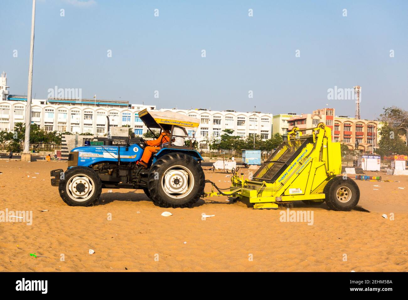 Beach sand cleaning machinery trawling the sand for rubbish Stock Photo ...