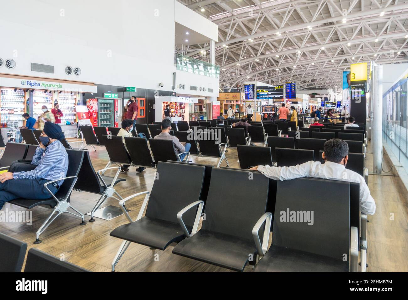 Chennai airport waiting area after security clearance Stock Photo - Alamy